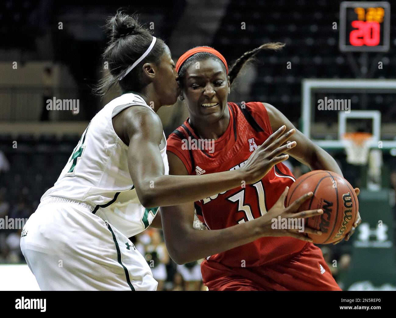 Louisville forward Asia Taylor (31) runs into South Florida forward ...