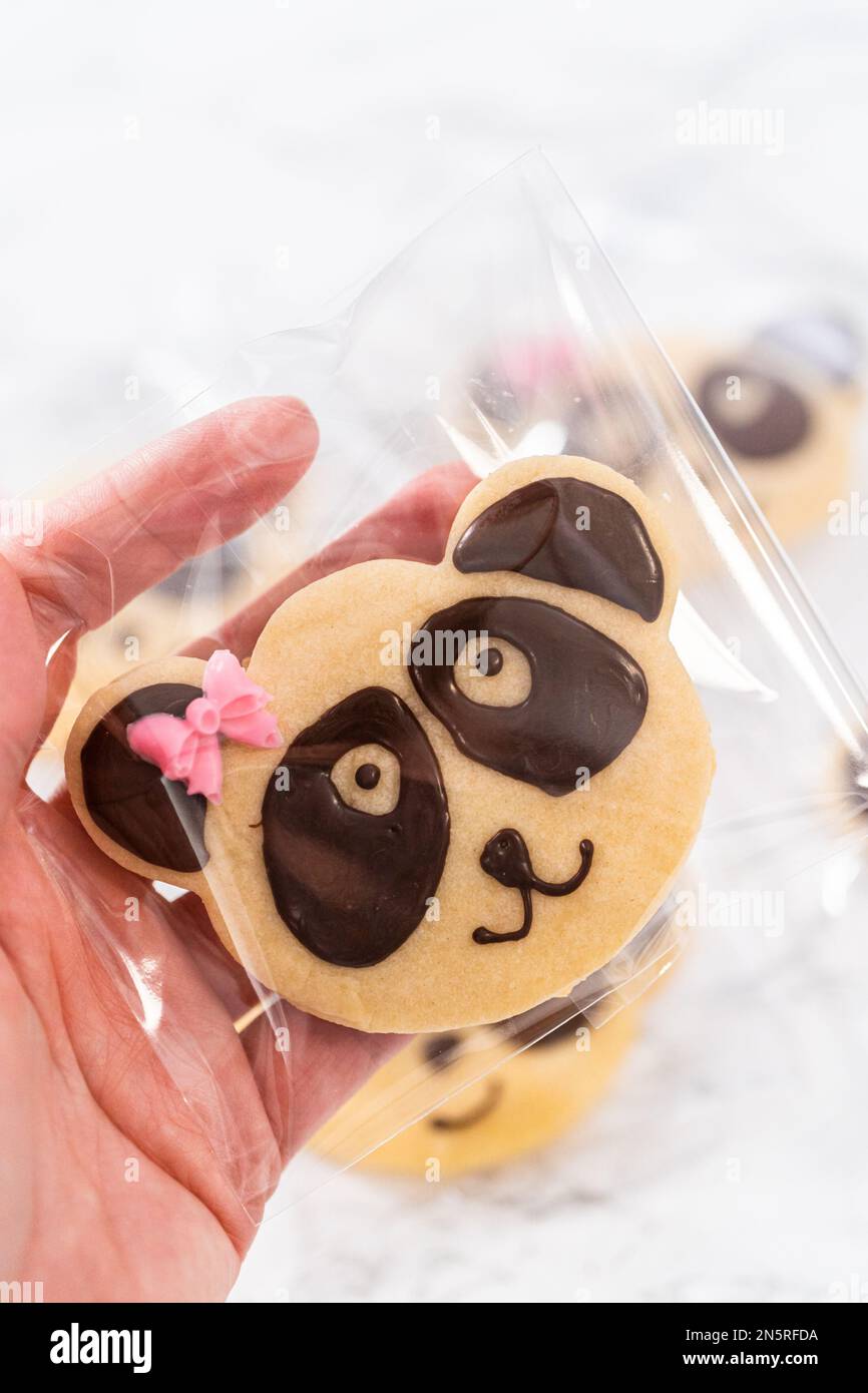 Panda shaped shortbread cookies with chocolate icing Stock Photo - Alamy