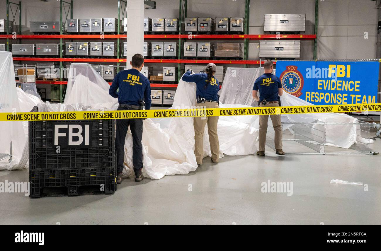 In this image provided by the FBI, FBI special agents assigned to the ...