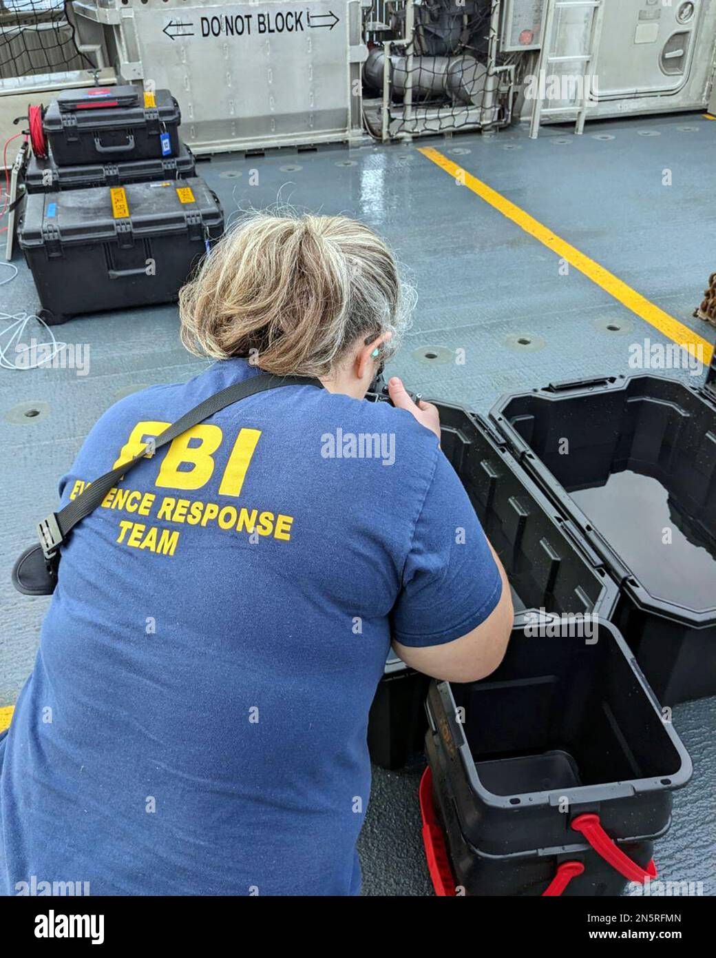 In this image provided by the FBI, an FBI evidence response team ...