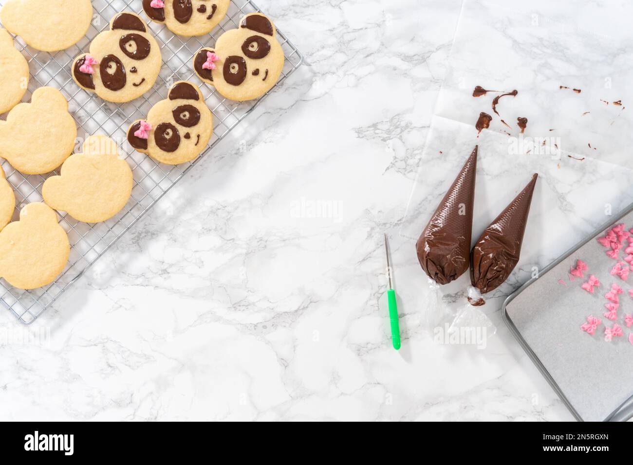 Panda shaped shortbread cookies with chocolate icing Stock Photo - Alamy