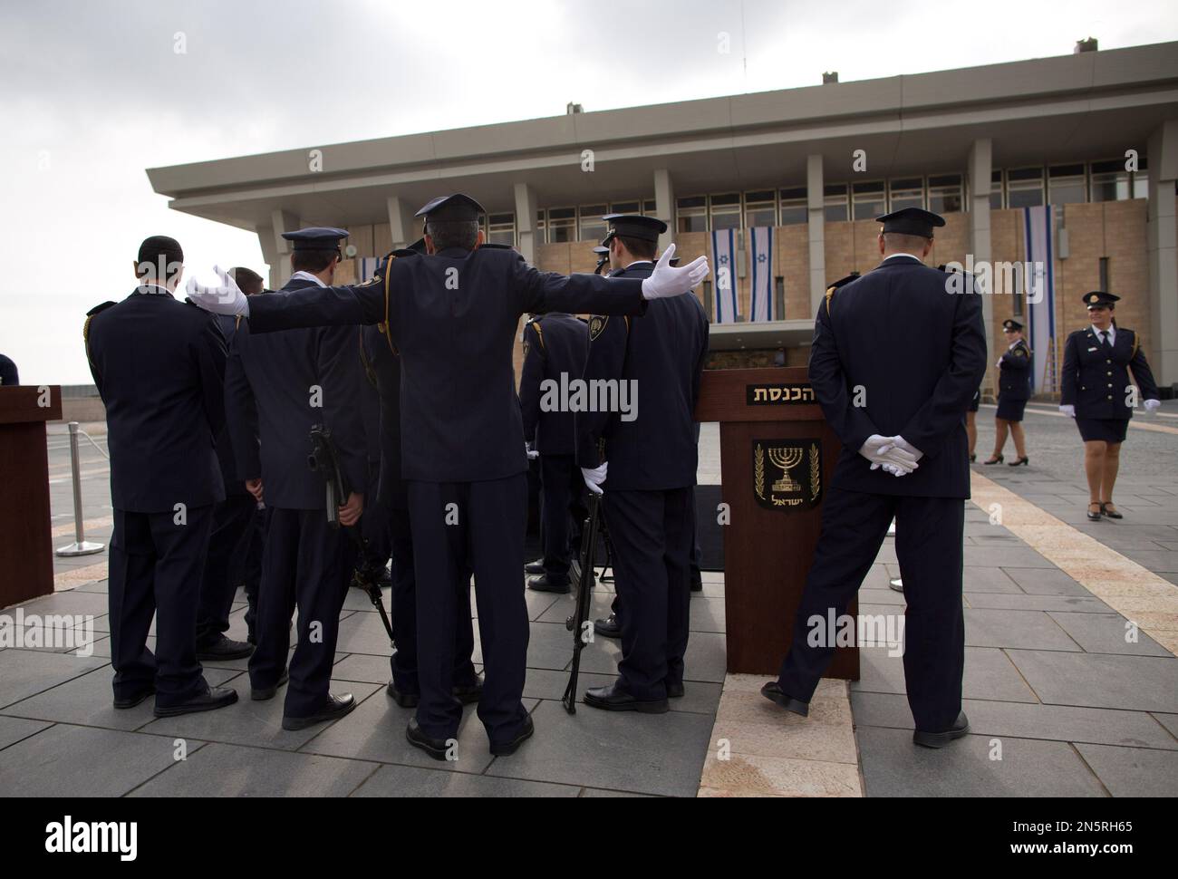Members of the Knesset guard wait for the coffin of former Israeli ...