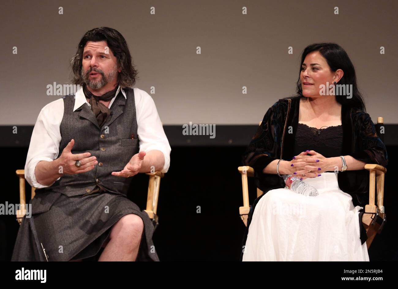 Ronald D. Moore, left, and Diana Gabaldon are seen onstage at the STARZ ...