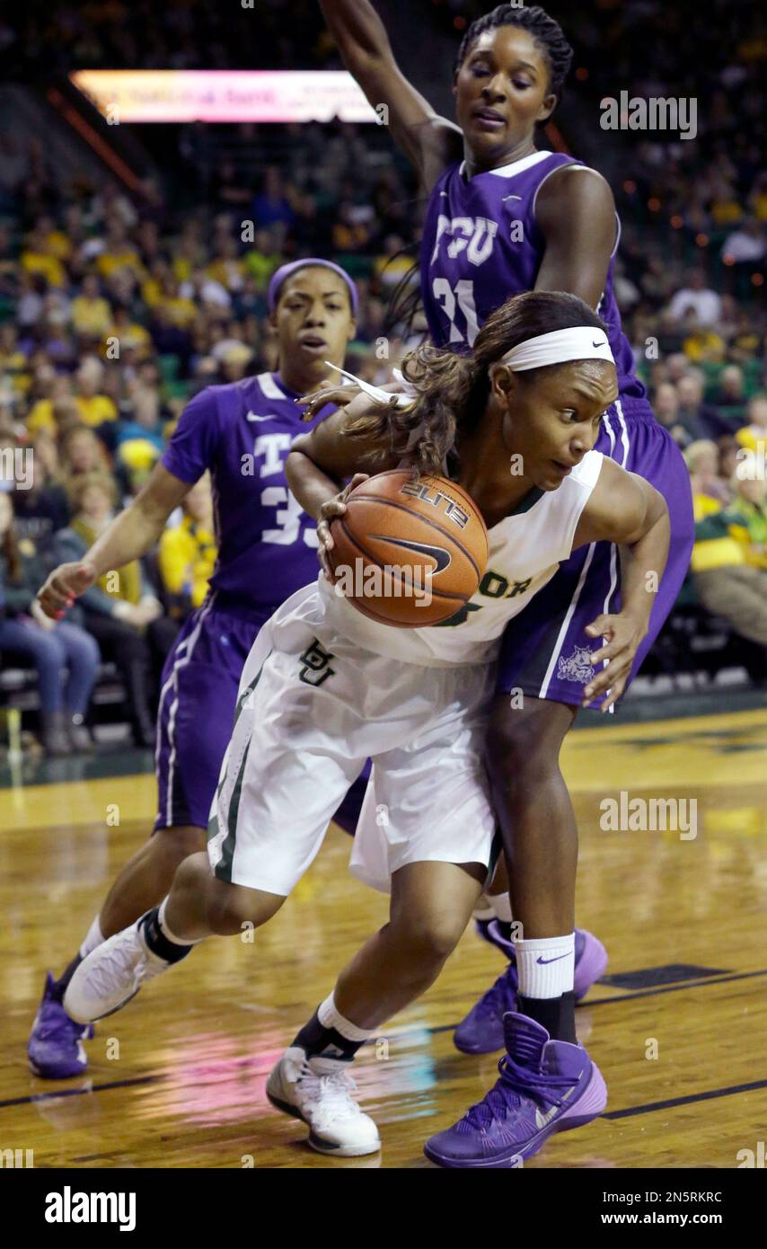 Baylor guard Alexis Prince (12) drives past TCU center Latricia Lovings ...