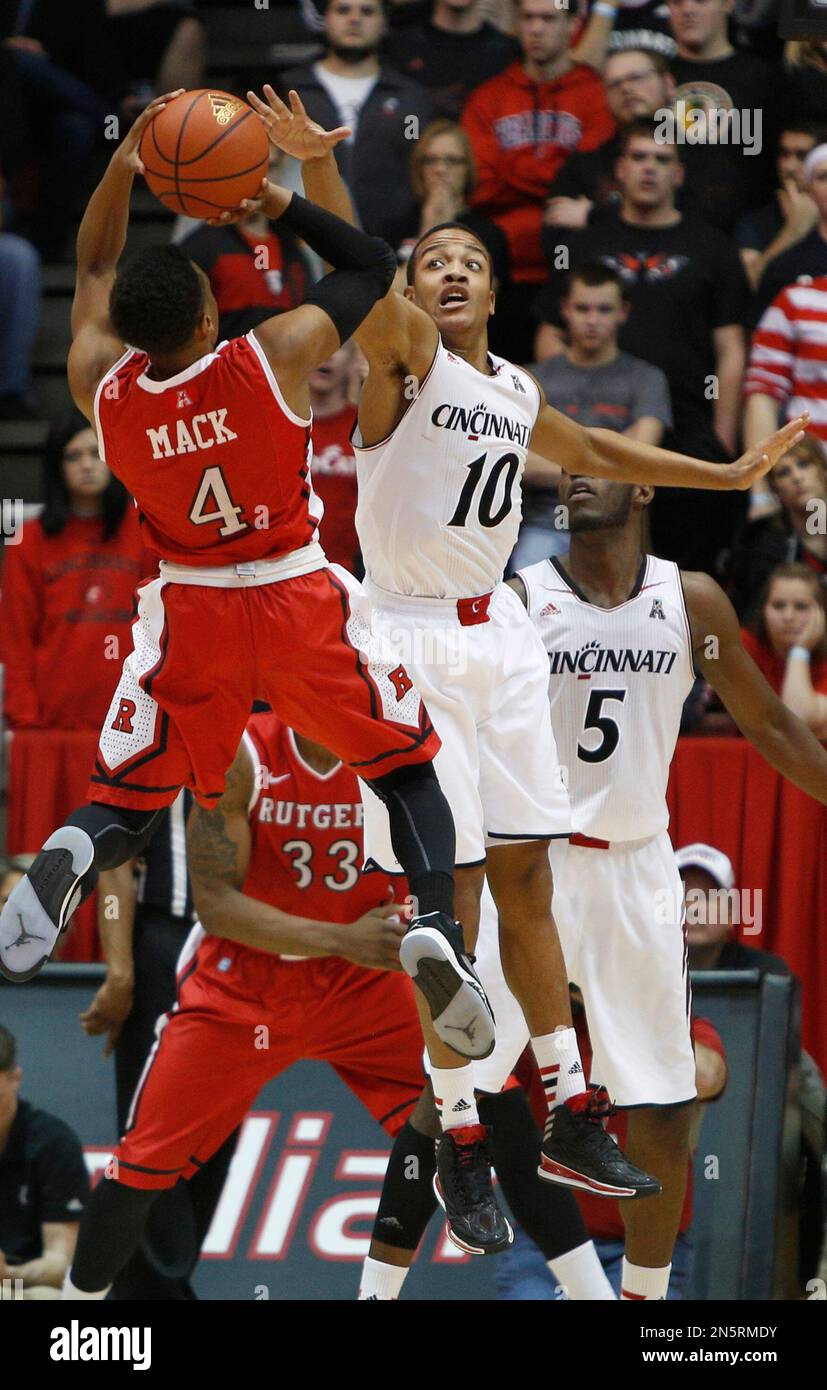 Rutgers guard Myles Mack (4) shoots against Cincinnati guard Troy ...