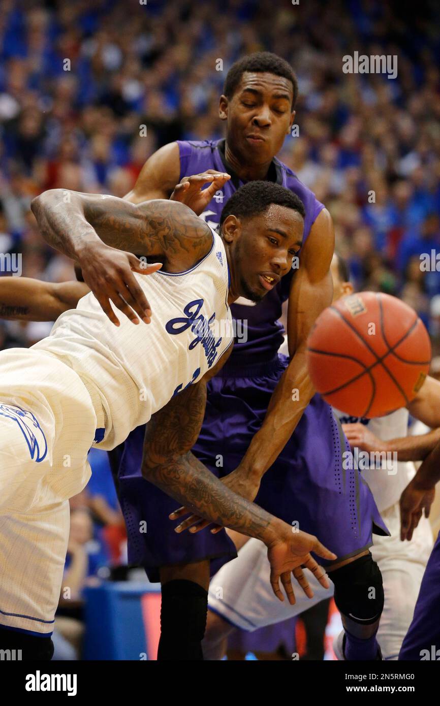 Kansas forward Jamari Traylor (31) rebounds against Kansas State guard ...