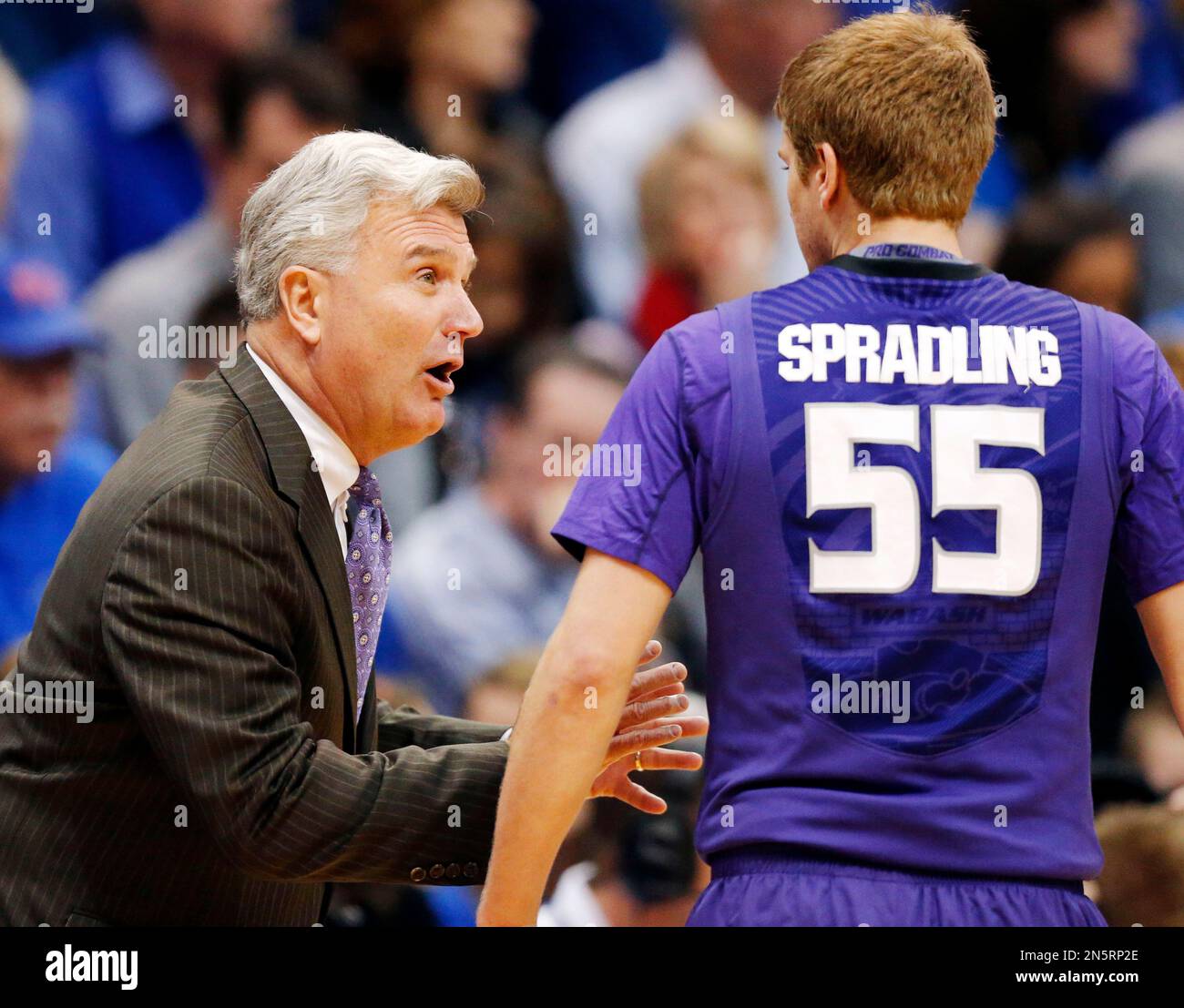 Kansas State head coach Bruce Weber talks with guard Will Spradling (55 ...