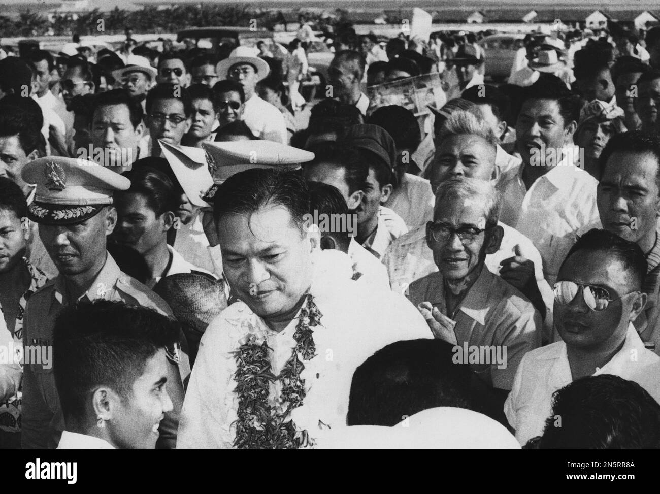 Philippine President Ramon Magsaysay is surrounded by well wishers ...