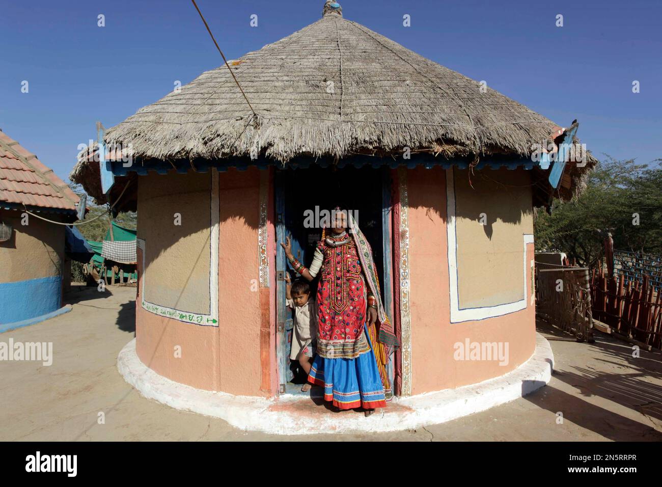 In this Friday, Jan. 10, 2014 photo, an Indian woman, wearing ...