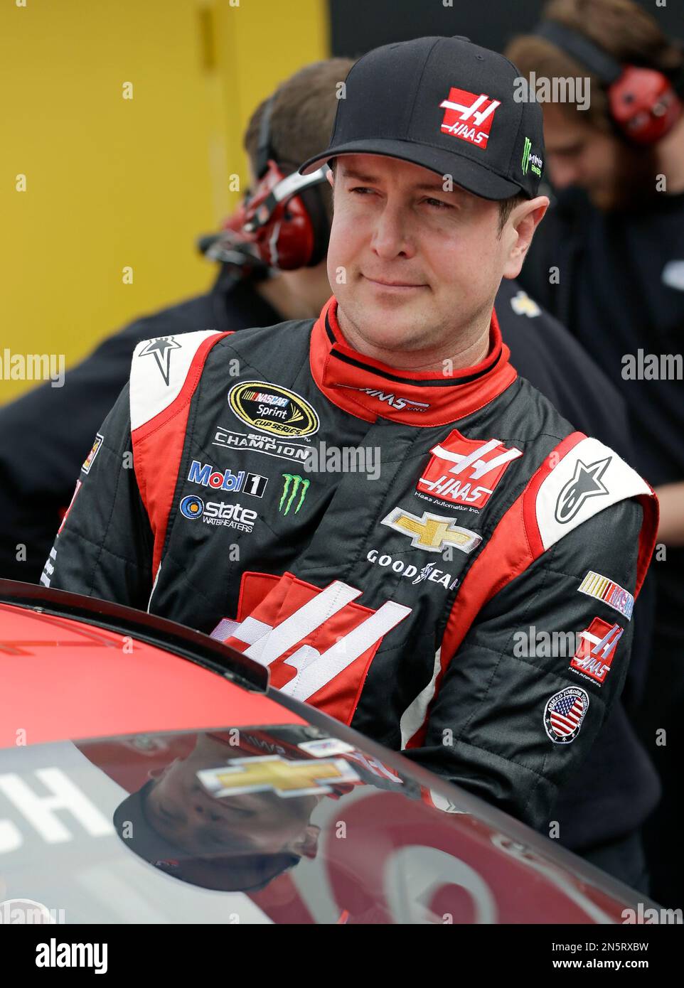 NASCAR driver Kurt Busch climbs in his car as he gets ready for Sprint ...