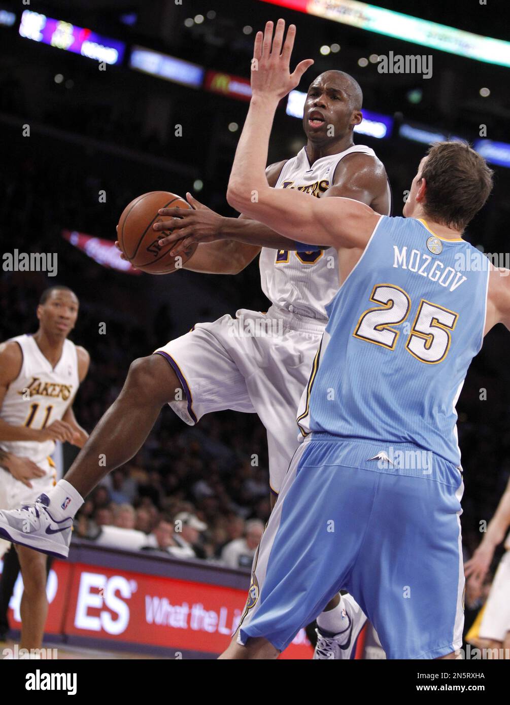 Los Angeles Lakers guard Jodie Meeks, left, lays up a shot against ...