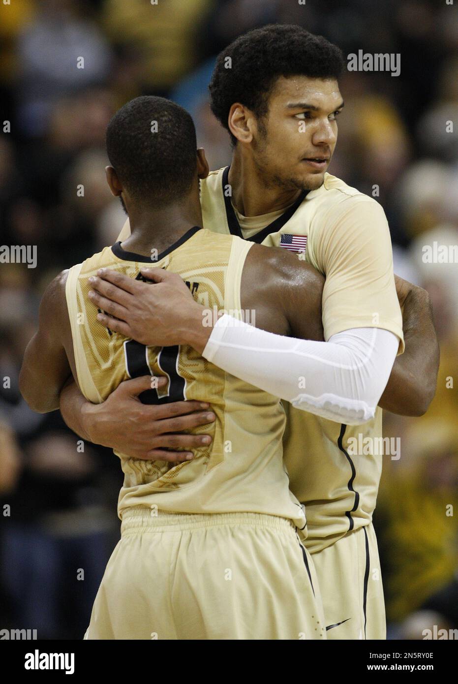 Wake Forest forward Devin Thomas, right, hugs teammate Codi Miller ...