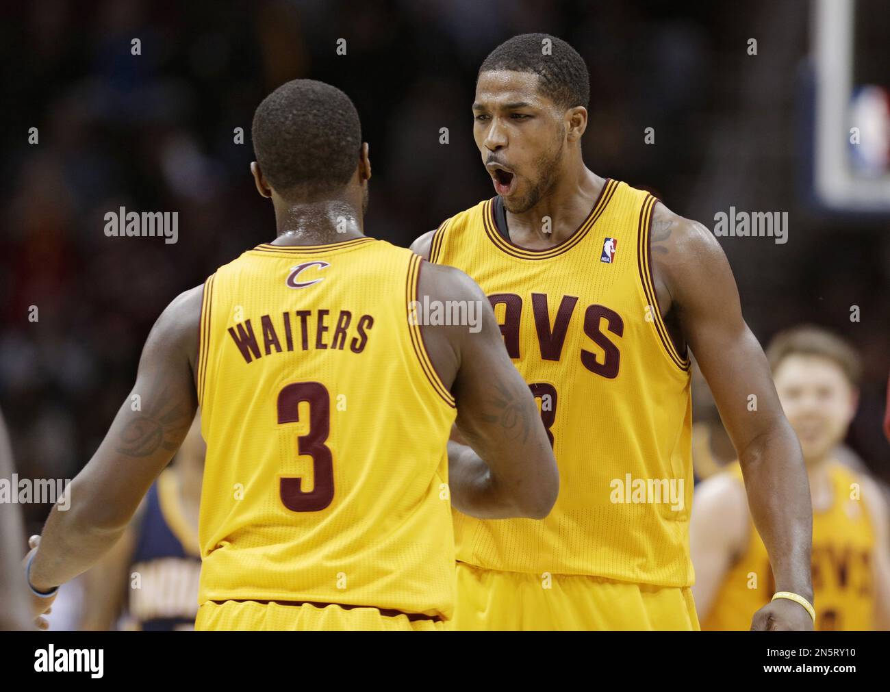 Cleveland Cavaliers' Tristan Thompson, right, from Canada, celebrates ...