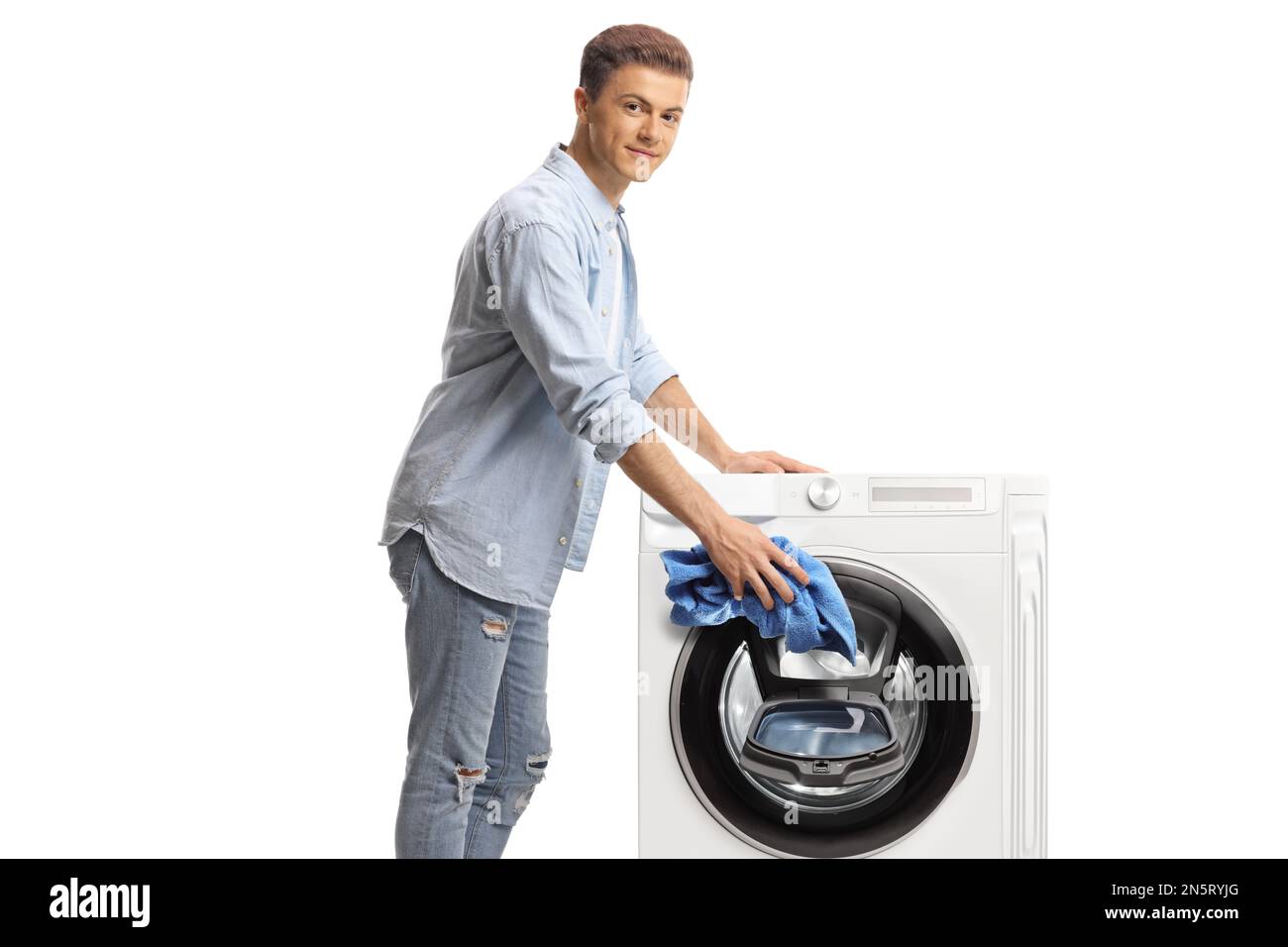 Loading washing machine hi-res stock photography and images - Alamy