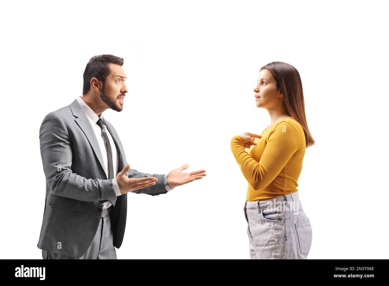 Businessman arguing with a young female isolated on white background ...