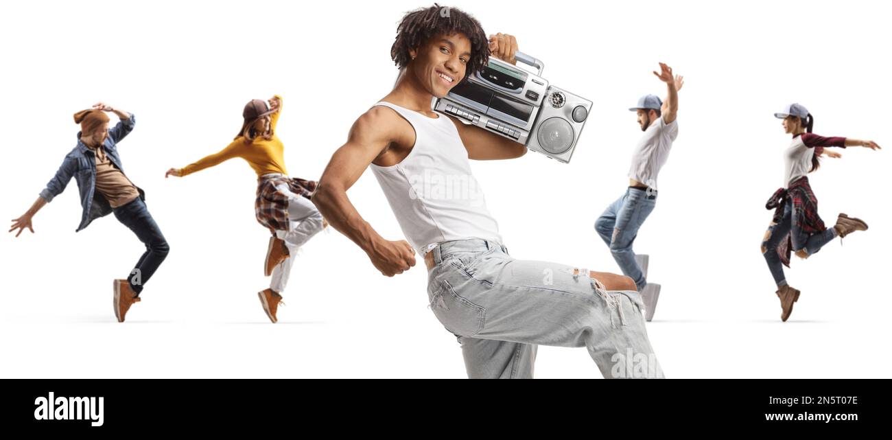 African american young man holding a boombox and people dancing in the ...