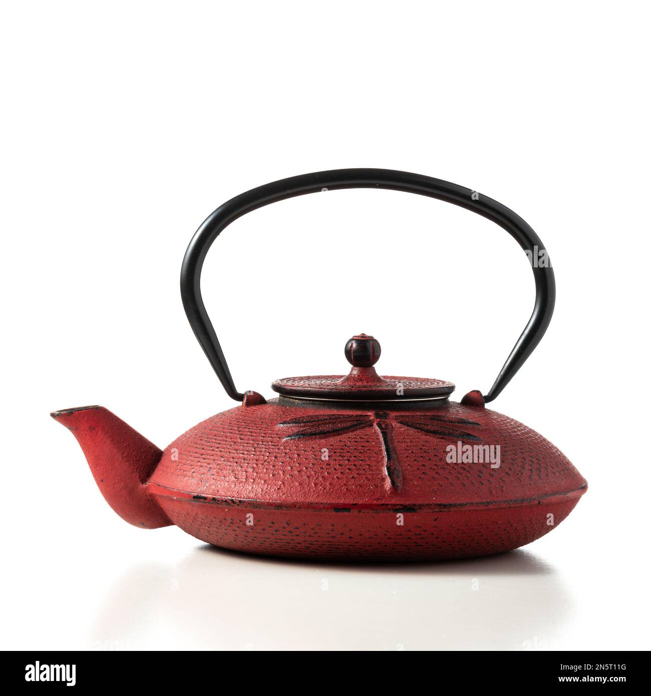 Red teapo on white background Stock Photo - Alamy