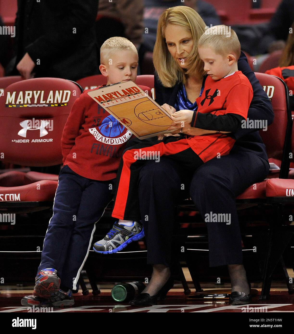 Maryland head coach Brenda Frese sits with her twin sons, Tyler, left ...
