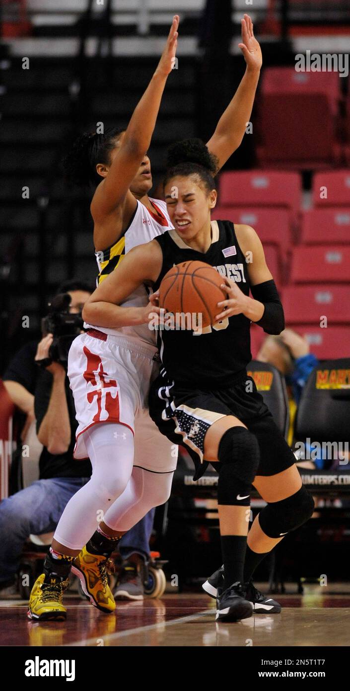 Maryland's Alyssa Thomas, left, defends as Wake Forest's Dearicia Hamby ...