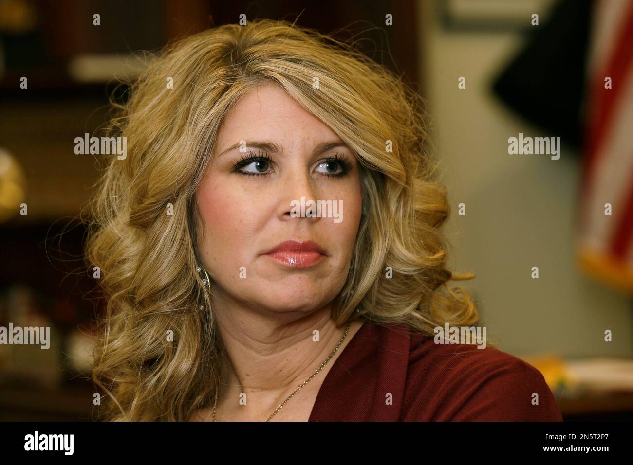 Kim Darr, wife of Arkansas Lt. Gov. Mark Darr, listens as the ...