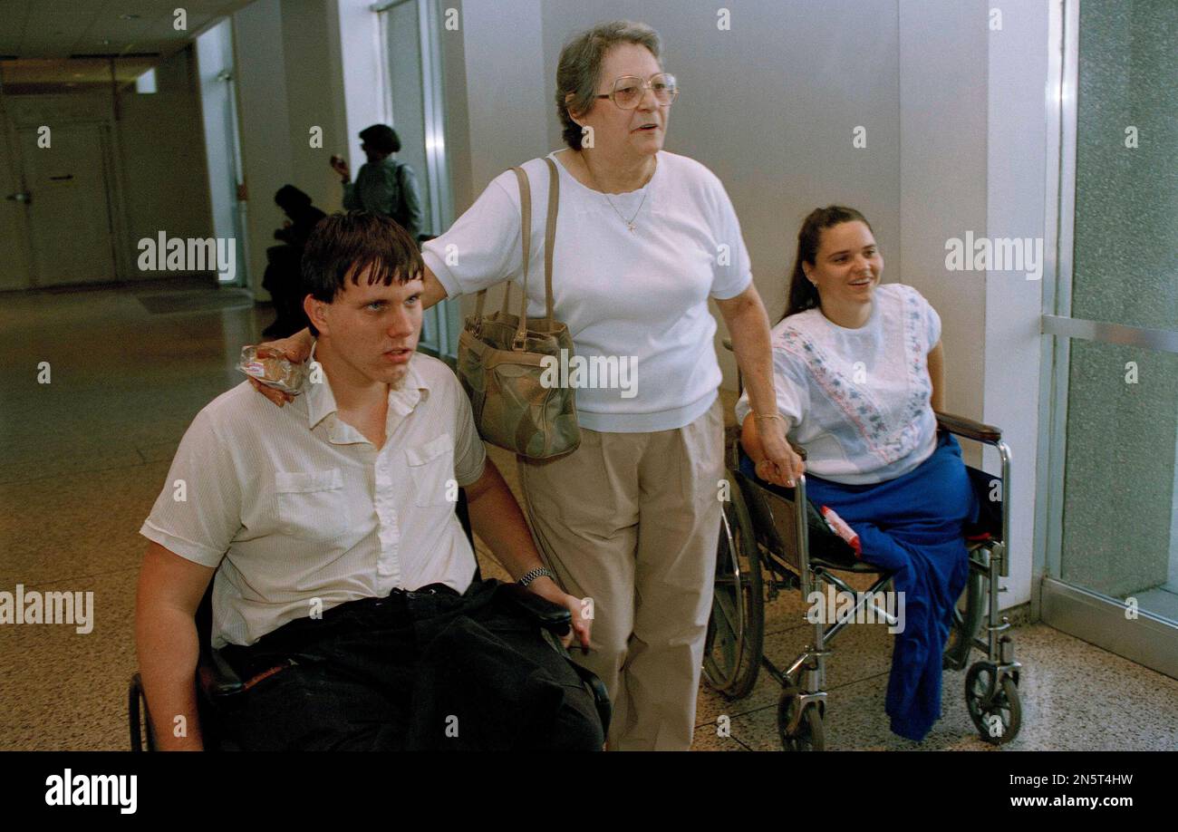 Mary Teresa Stiles, center, flanked by her children, Grady Stiles III, left, and Cathy Stiles ...