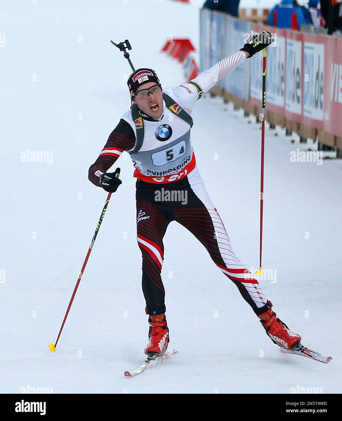 Austria's Dominik Landertinger crosses the finish line to win during ...