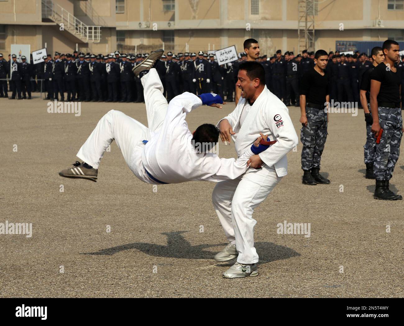 Iraqi Federal Police demonstrate their skills during a ceremony marking ...