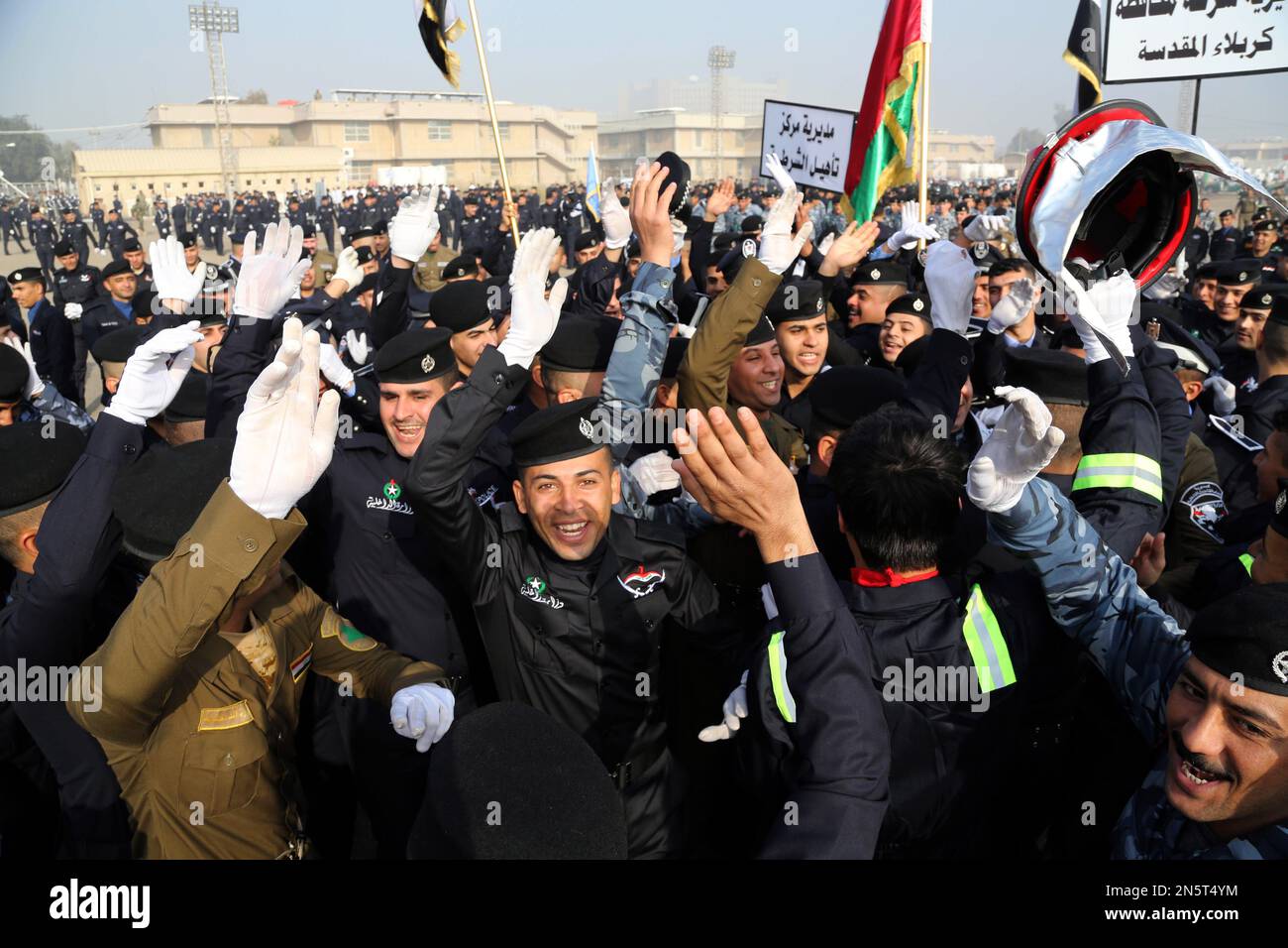 Iraqi Police chant anti-terrorism slogans during a ceremony marking ...