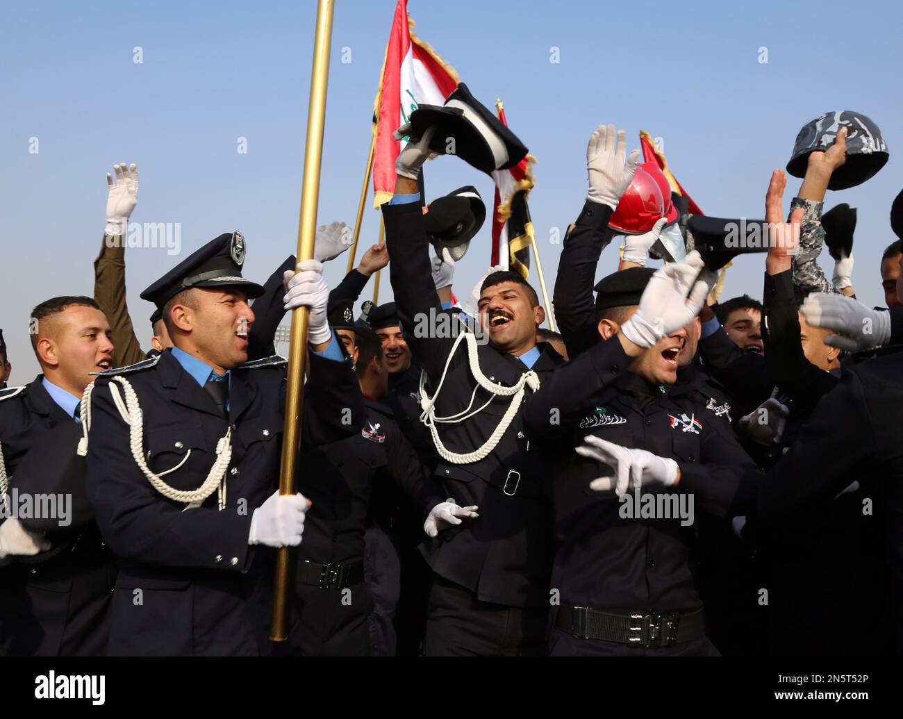 Iraqi Police chant anti-terrorism slogans during a ceremony marking ...
