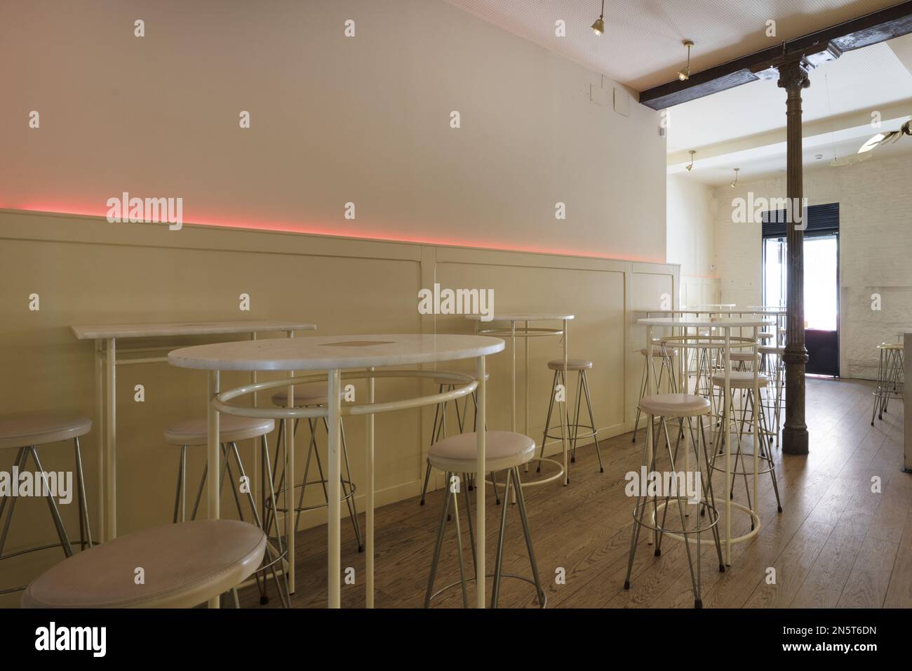 Circular high tables with matching stools in a restaurant hall Stock ...