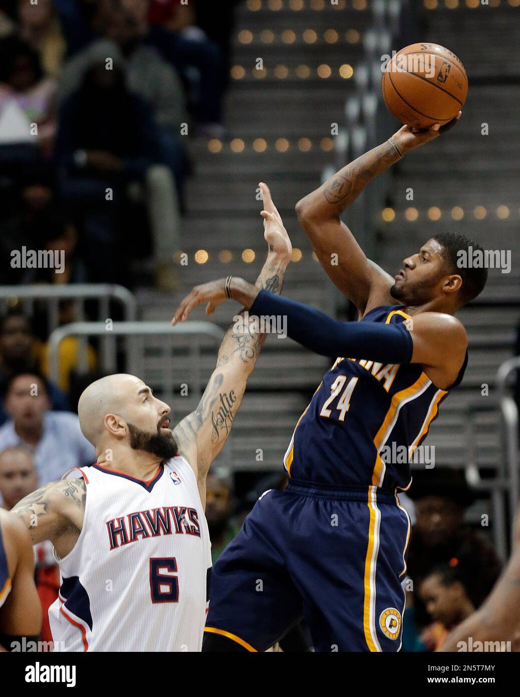 Indiana Pacers forward Paul George (24) takes a shot against Atlanta ...