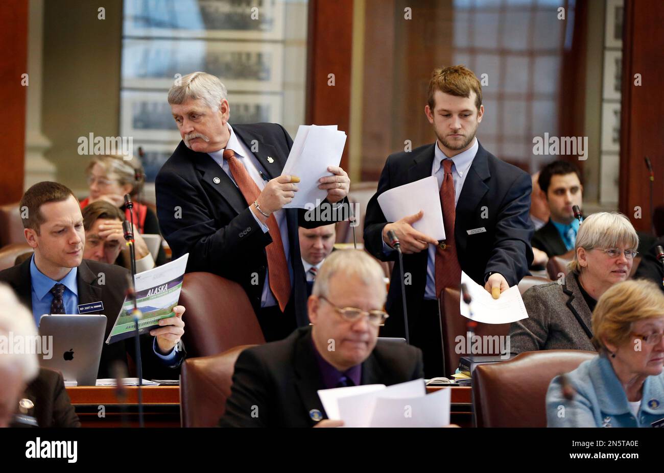House Chamber staffers Fred Hatch, left, and Jeremy Payson distribute ...