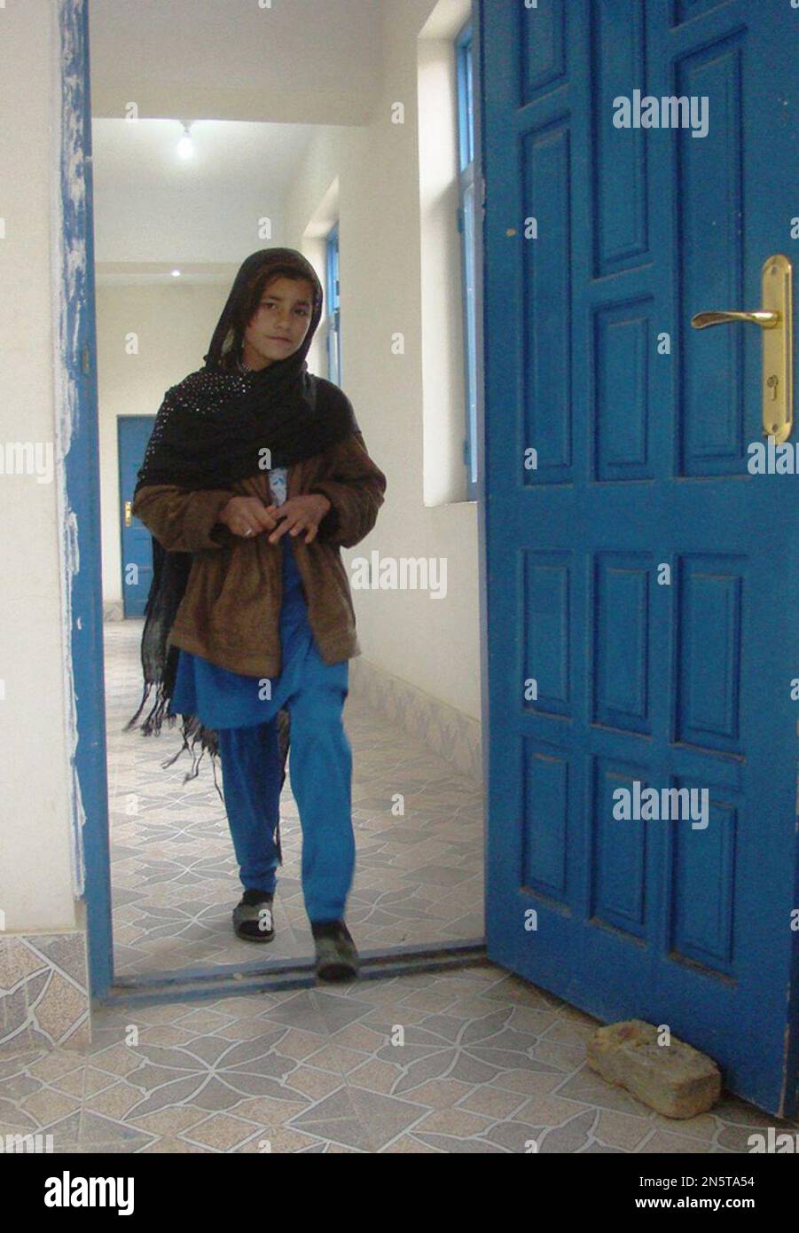 An Afghan girl known as Spozhmai is held in protective custody in ...