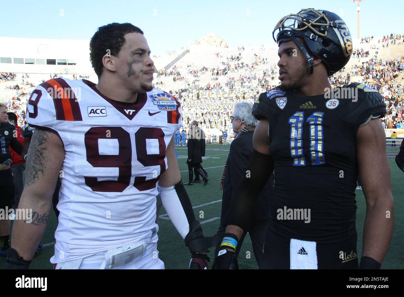 UCLA linebacker Anthony Barr, right, and Virginia Tech defensive end ...