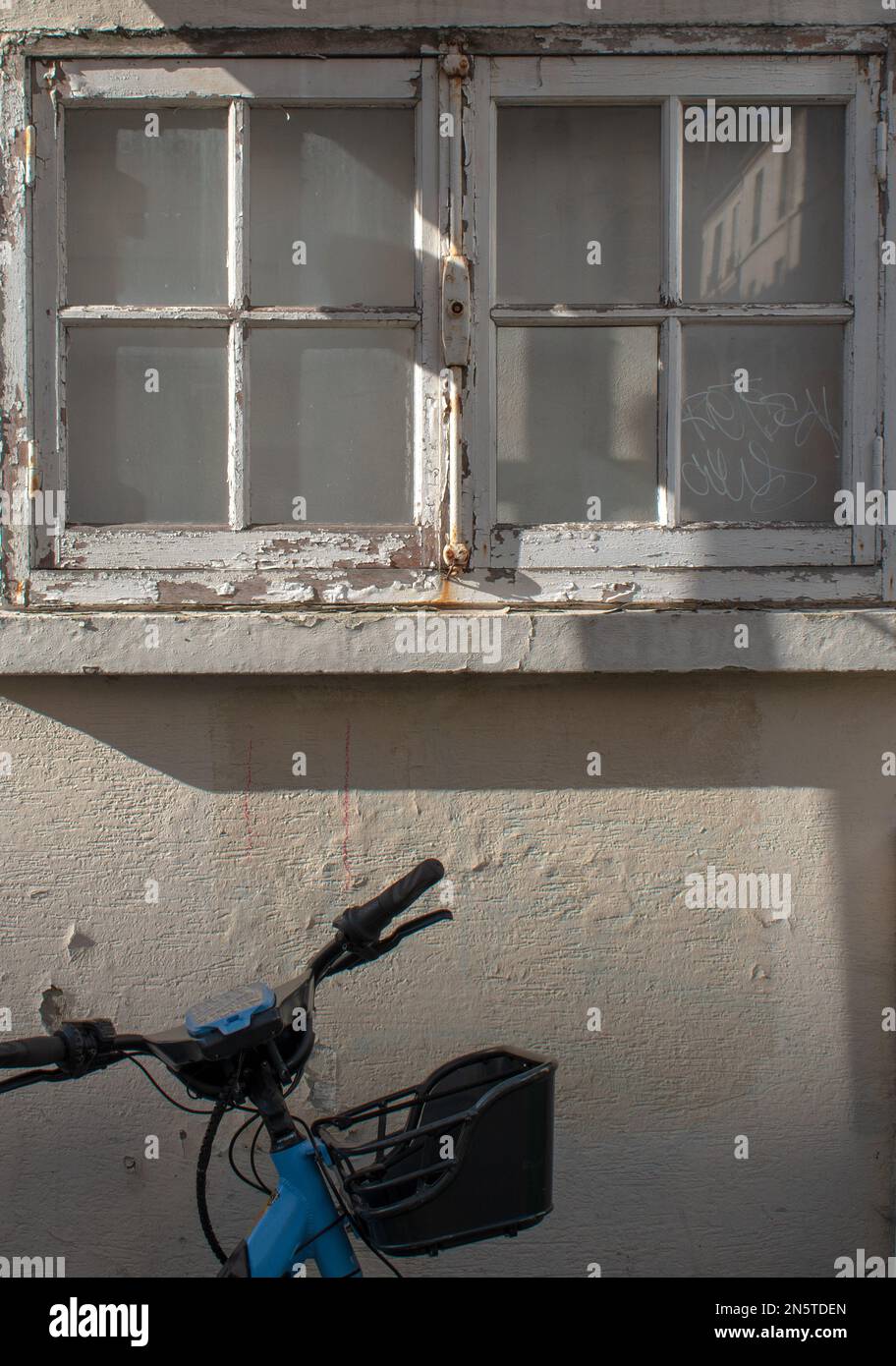 Electric bike in front of an old window in Paris (France Stock Photo ...