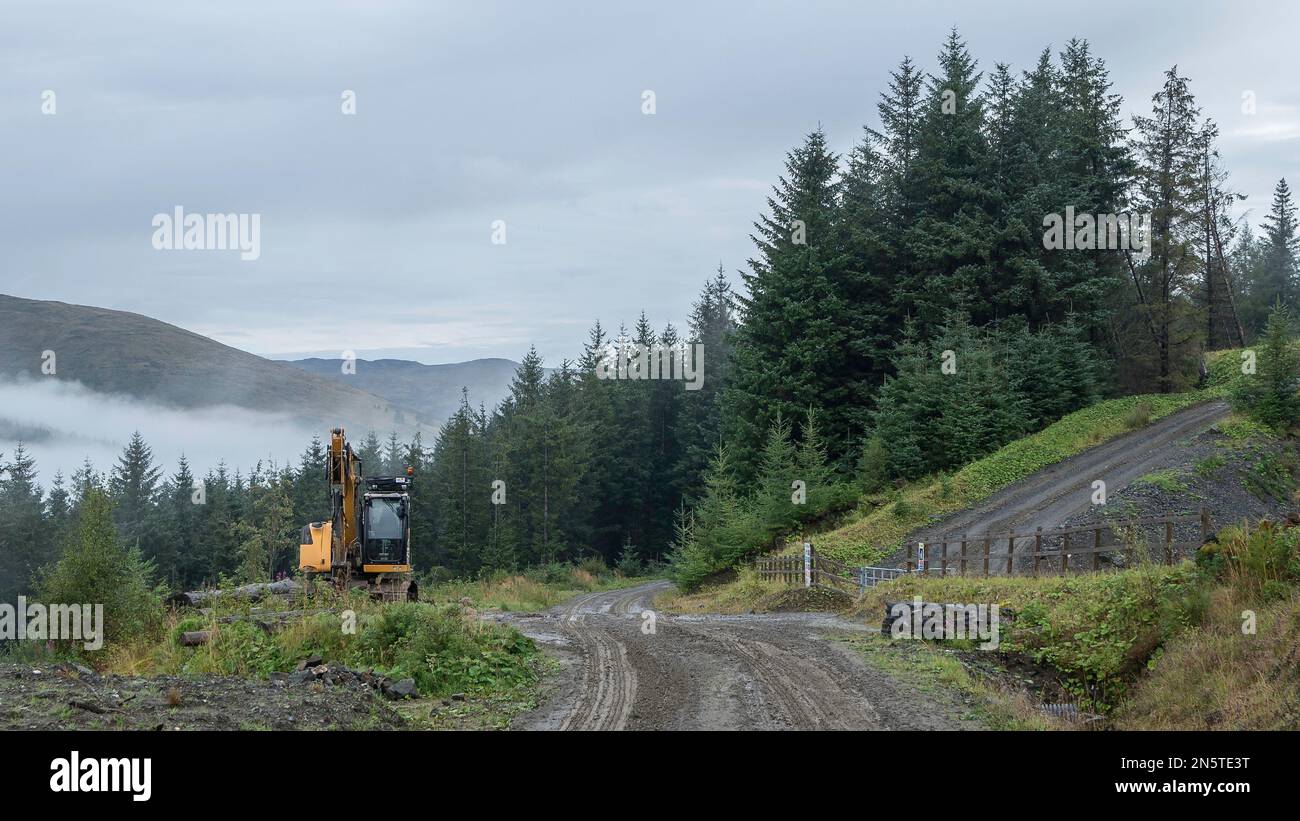 Forestry machinery on the Rob Roy Way in Strathyre Forest on a cloudy ...