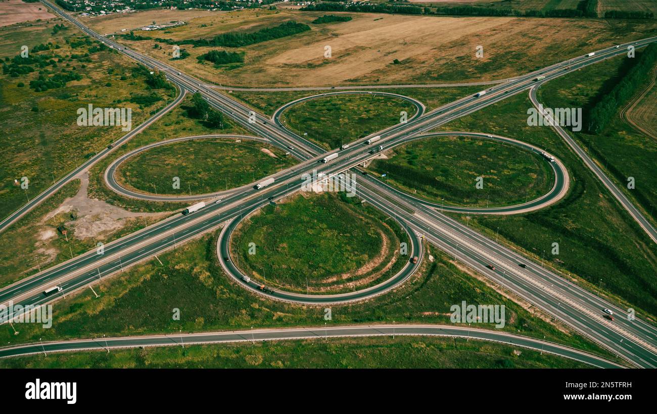 Clover or daisy, simple and cheap type of road junction. Aerial view of ...