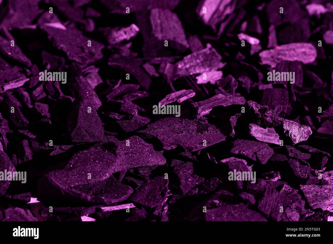 Natural black charcoal with a purple tint. Industrial coal. Pile of ...