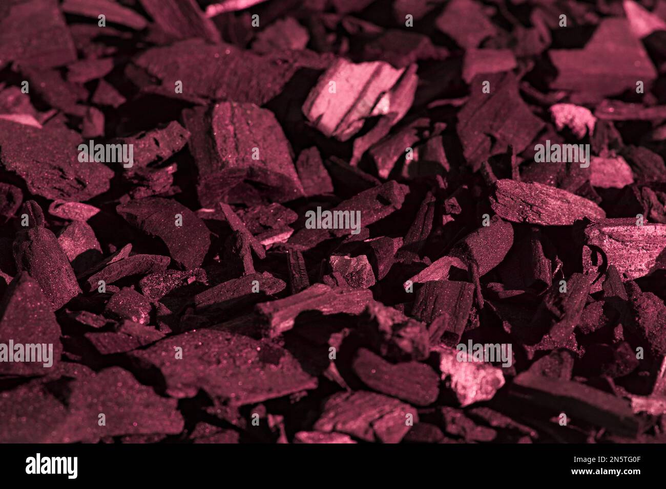 Natural black charcoal with a pink tint. Industrial coal. Pile of black ...