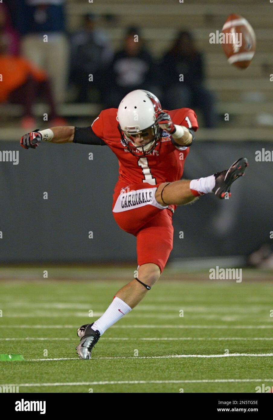 Ball State place kicker Scott Secor (1) kicks off against Arkansas ...