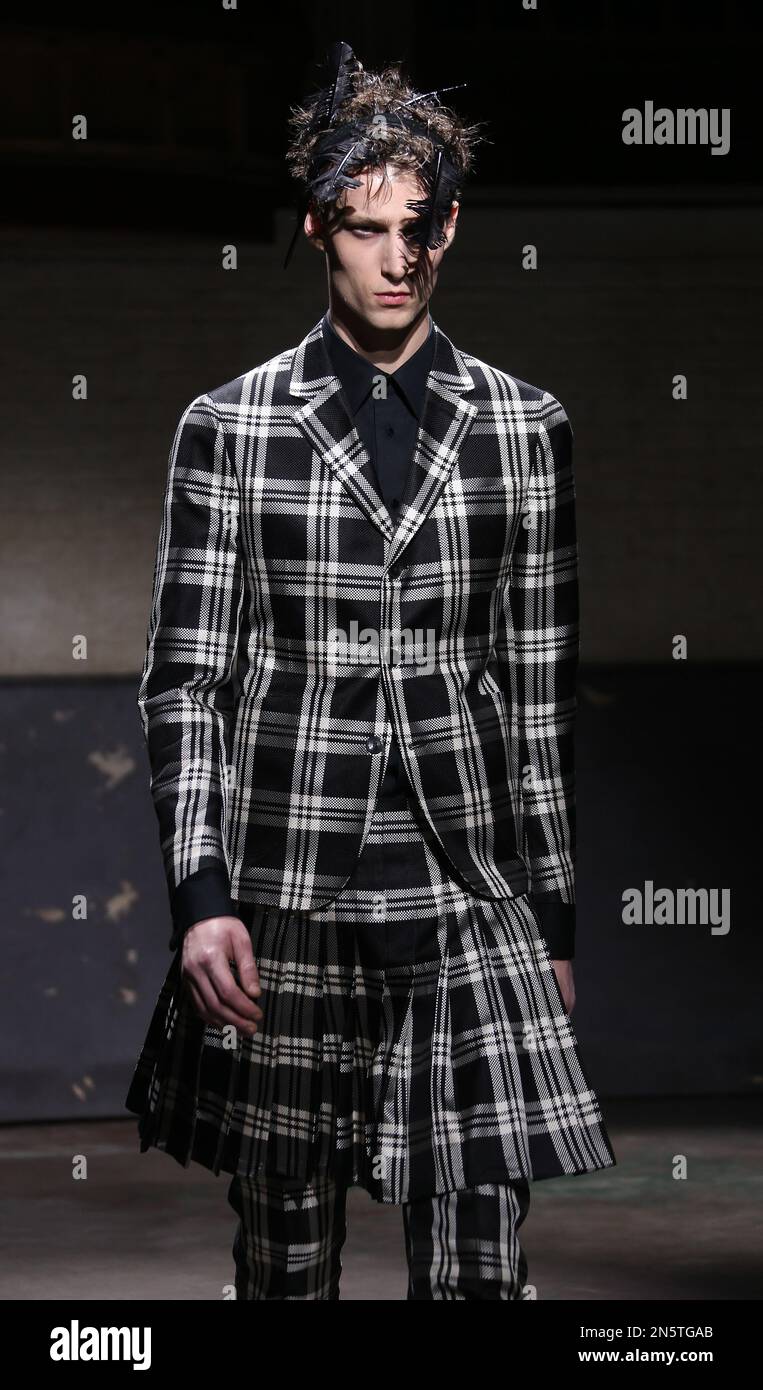 A model wears a design created by Alexander McQueen during London ...