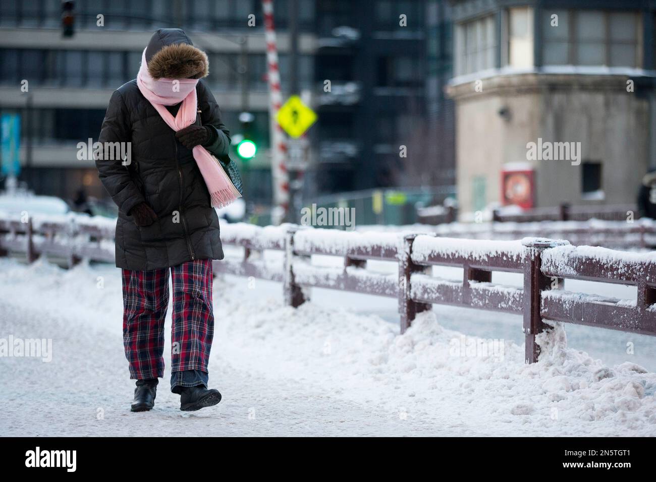 A commuter departs from Union Station with wind chills nearing minus 30 Fahrenheit on Tuesday ...