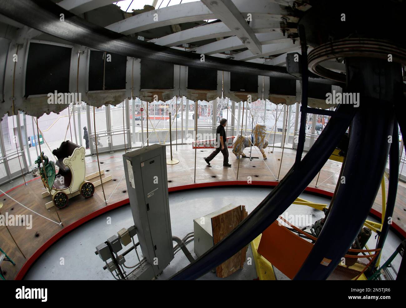 Brian Linke walks past a chariot and covered horse before they were ...