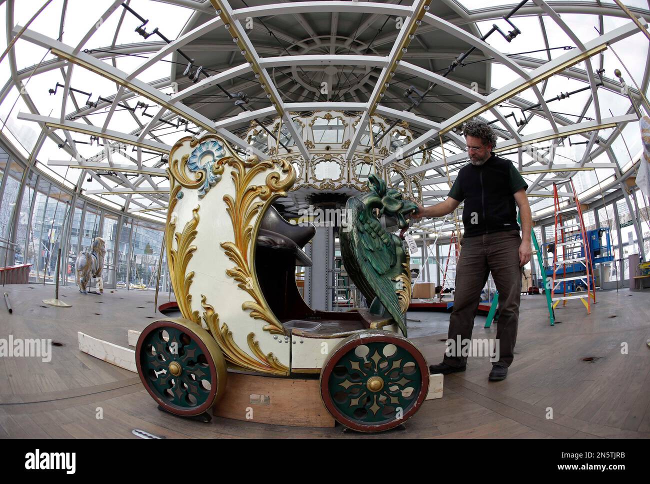 Brian Linke looks over a chariot before it was removed from the ...