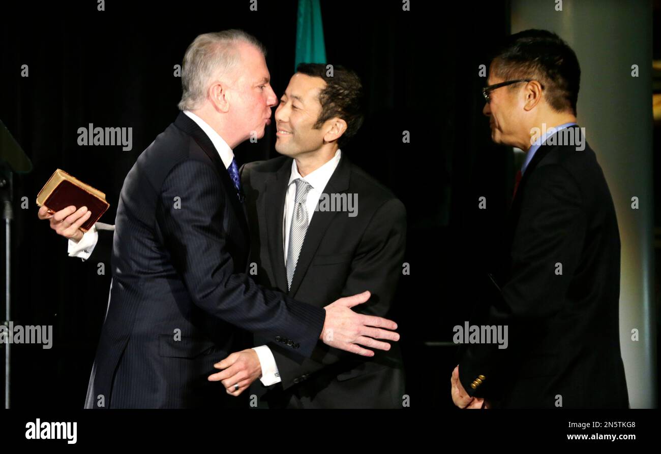 New Seattle Mayor Ed Murray, left, turns to kiss his husband, Michael ...