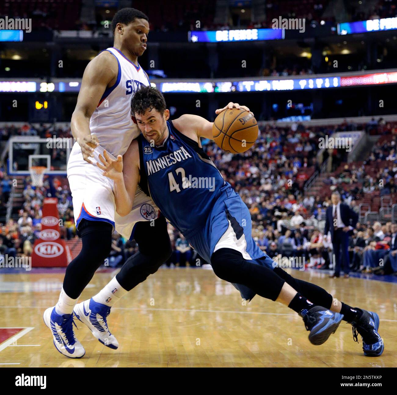 Minnesota Timberwolves' Kevin Love (42) tries to get past Philadelphia ...