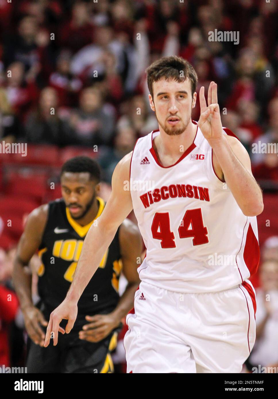 Wisconsin's Frank Kaminsky (44) signals after hitting a 3-point basket ...