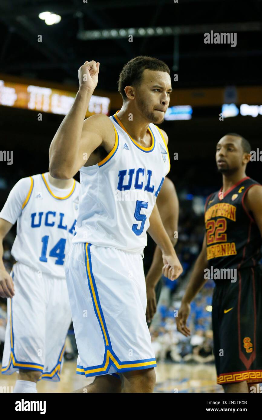 UCLA's Kyle Anderson, left, celebrates after scoring while being fouled ...
