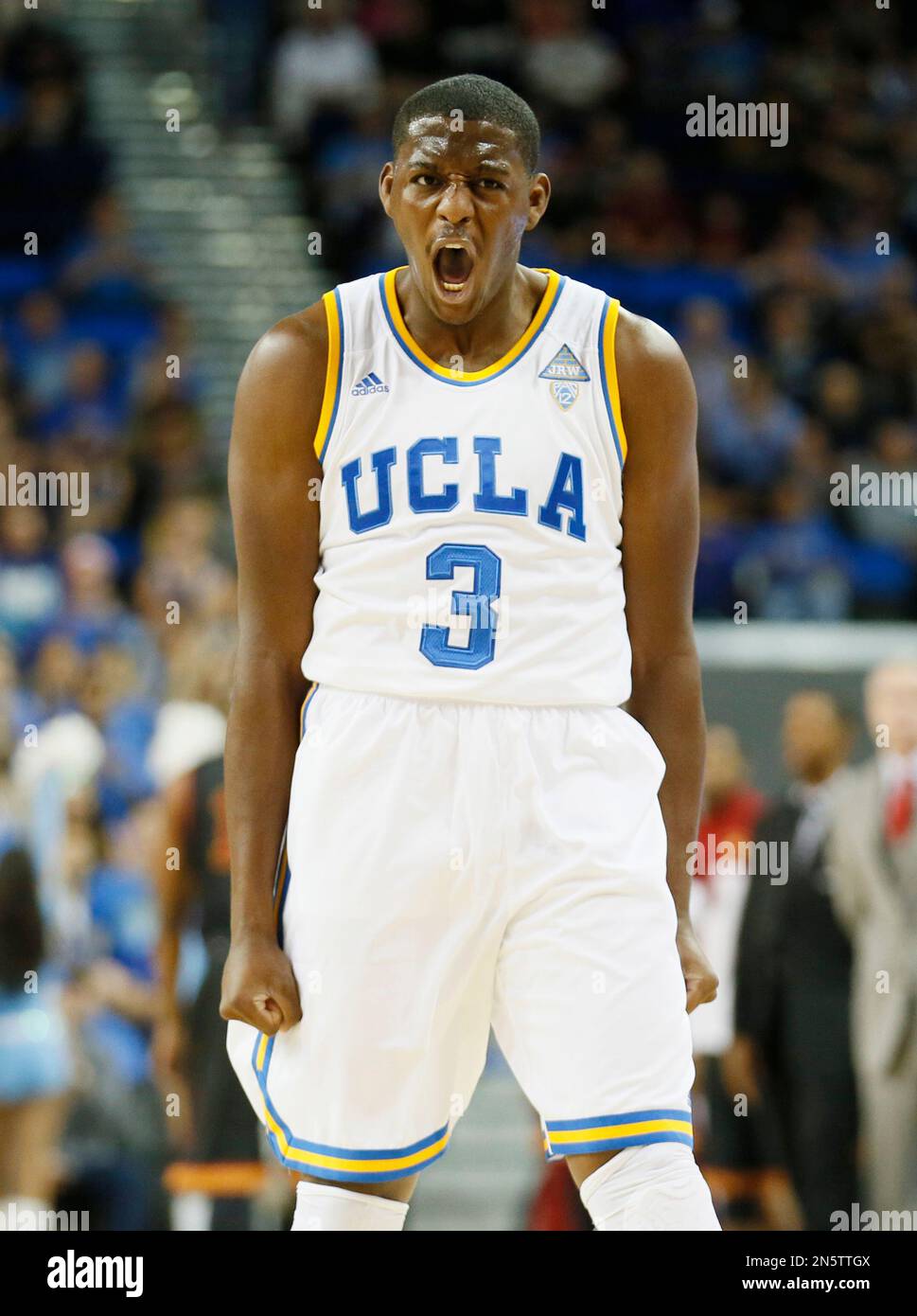 UCLA's Jordan Adams celebrates after scoring a three-point basket ...