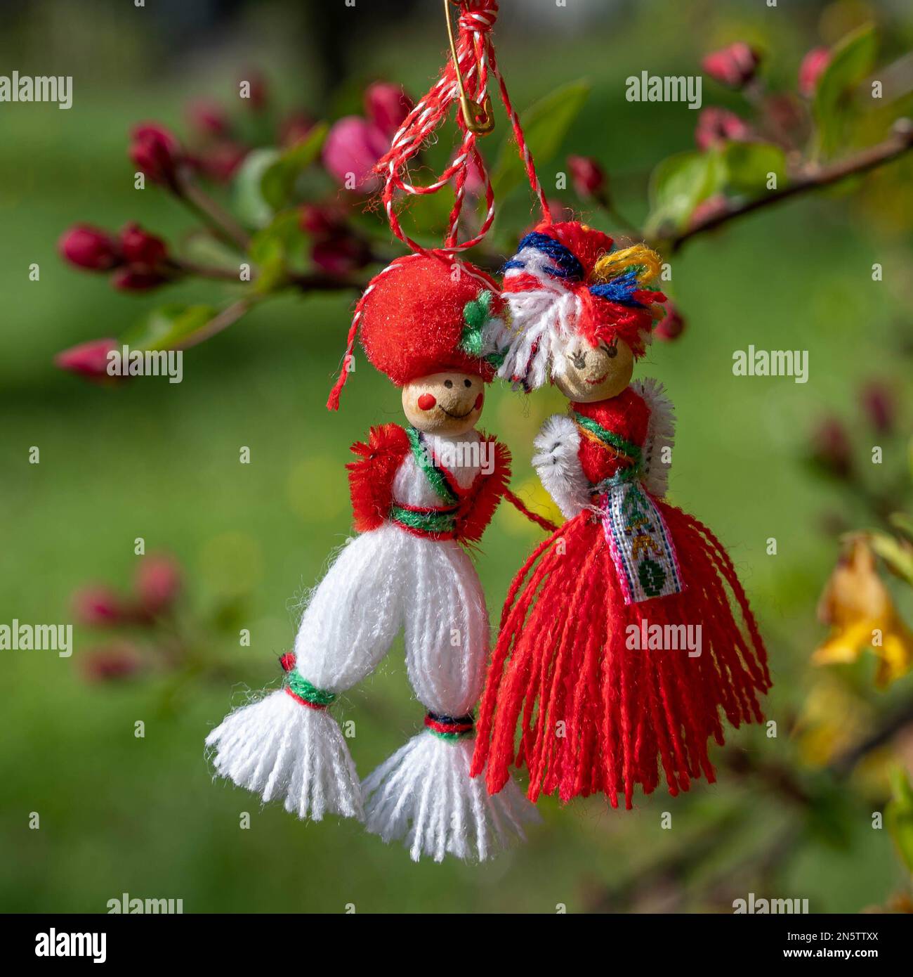 Greeting card background for the arrival of spring. Red-white man and ...